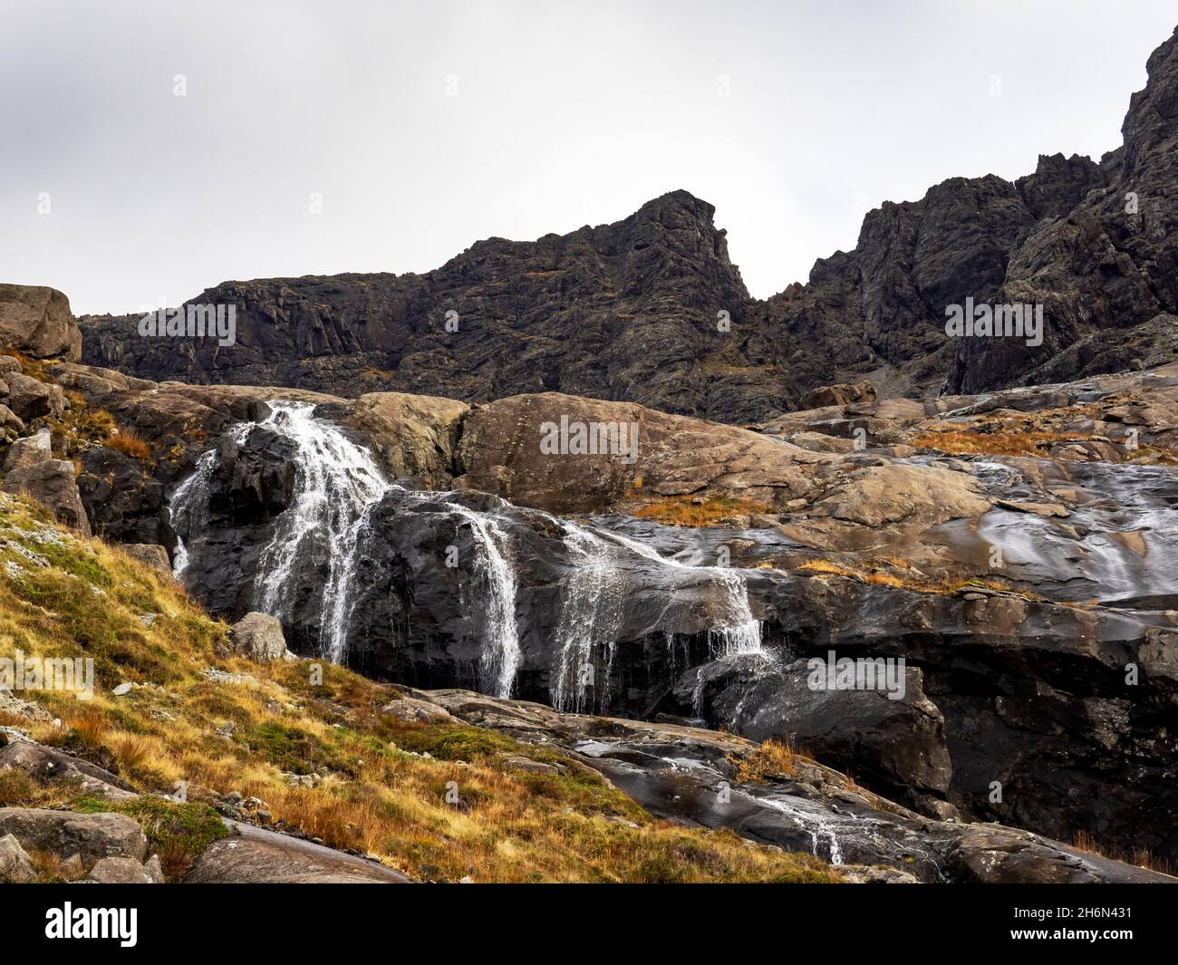 A waterfall coming out of Coire Lagan below Sgurr Mhic Choinnich; and ...