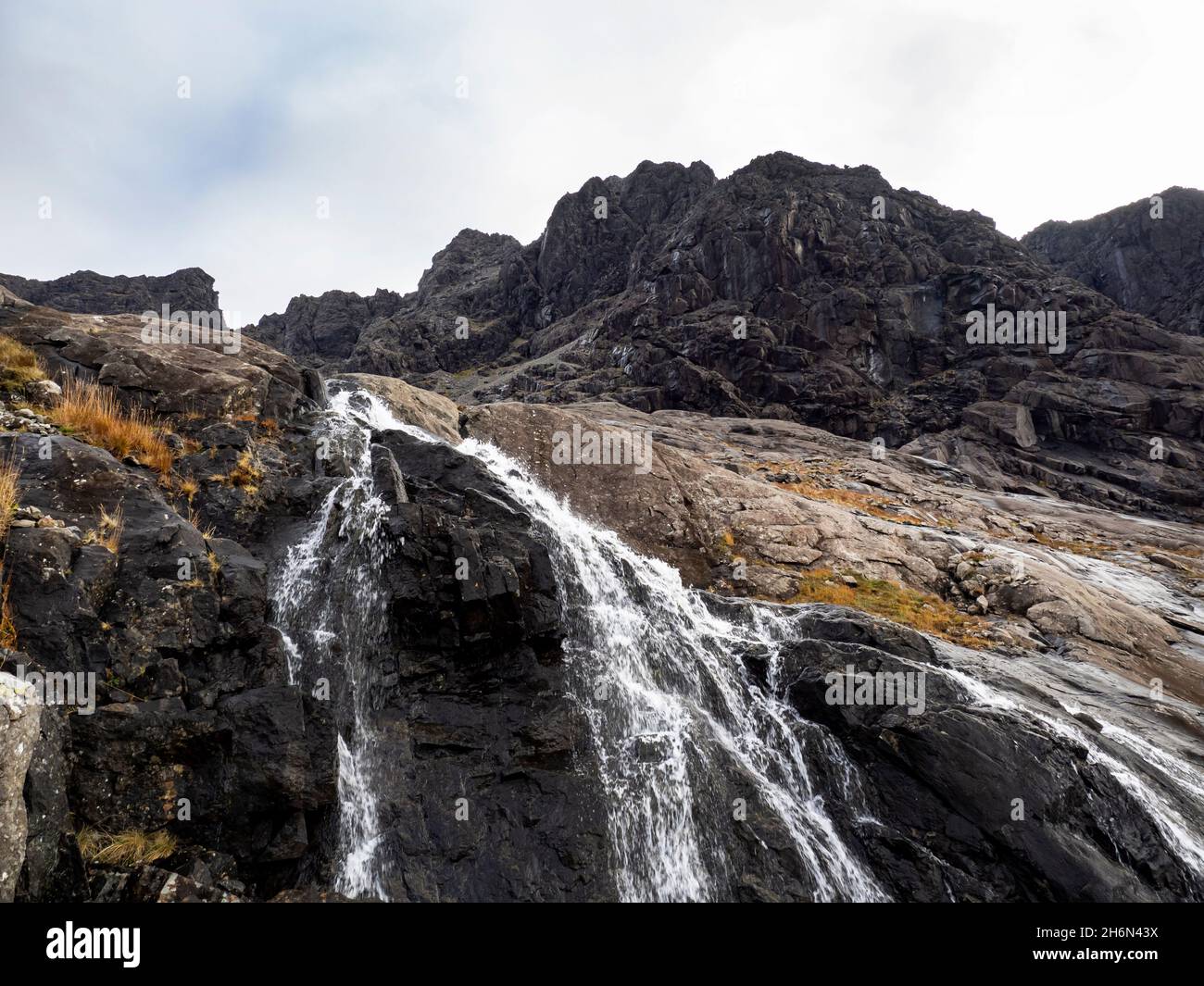 A waterfall coming out of Coire Lagan below Sgurr Mhic Choinnich; and ...