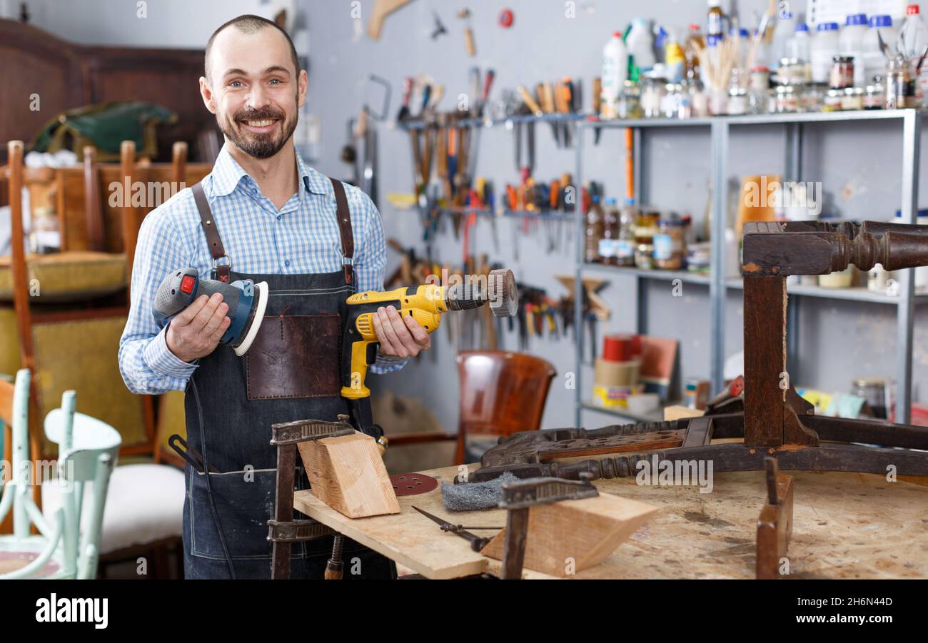 Craftsman repairing antique furniture Stock Photo - Alamy