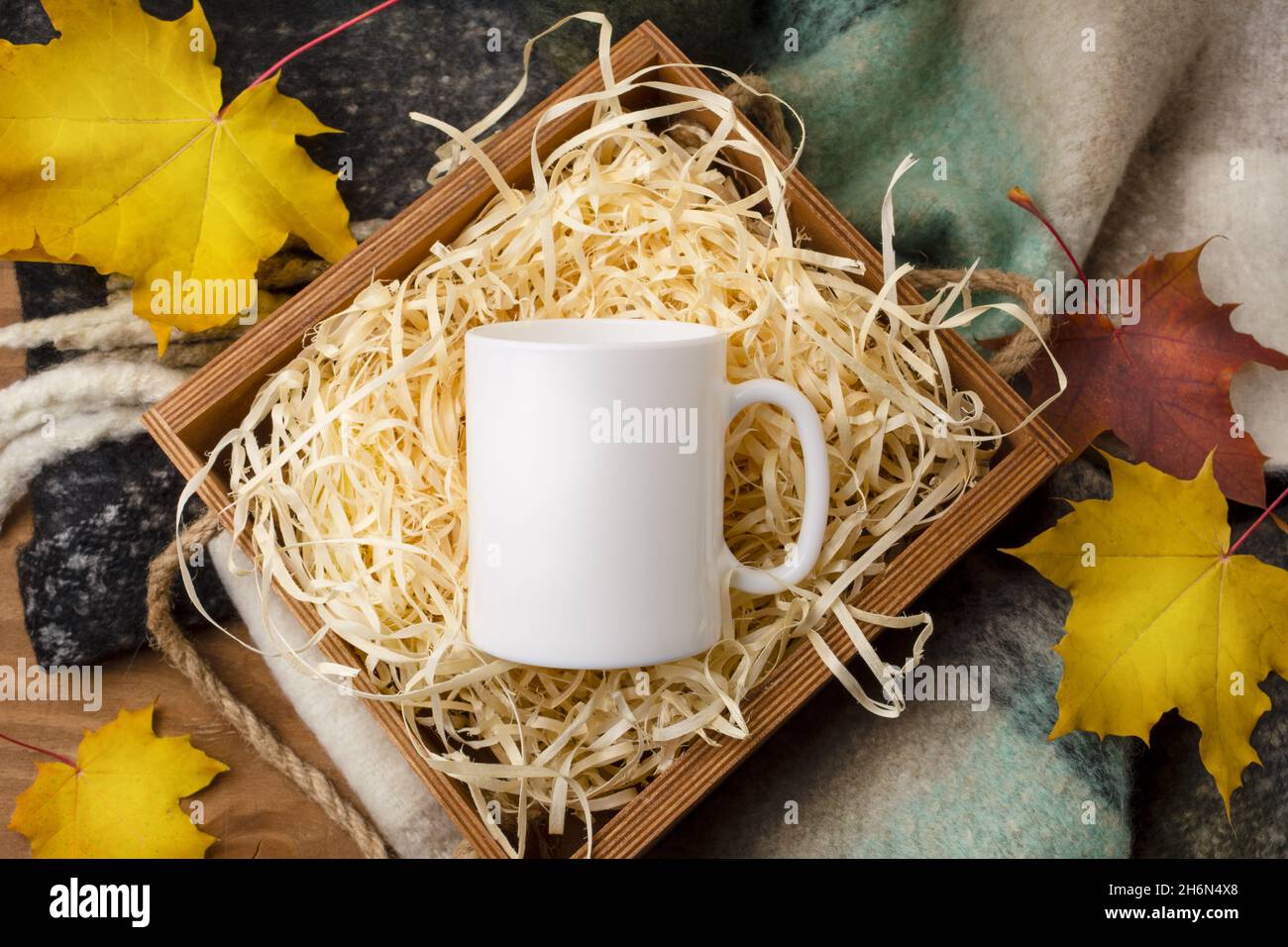 White coffee mug mockup with rustic wooden gift box and fall maple ...
