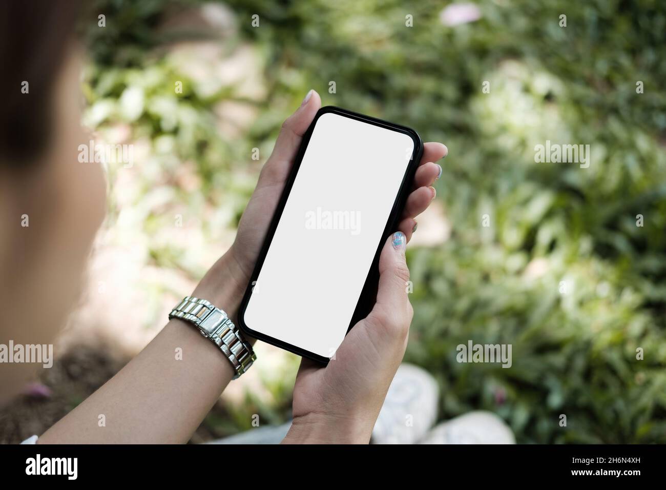 Woman hold cellphone outdoor hi-res stock photography and images - Alamy