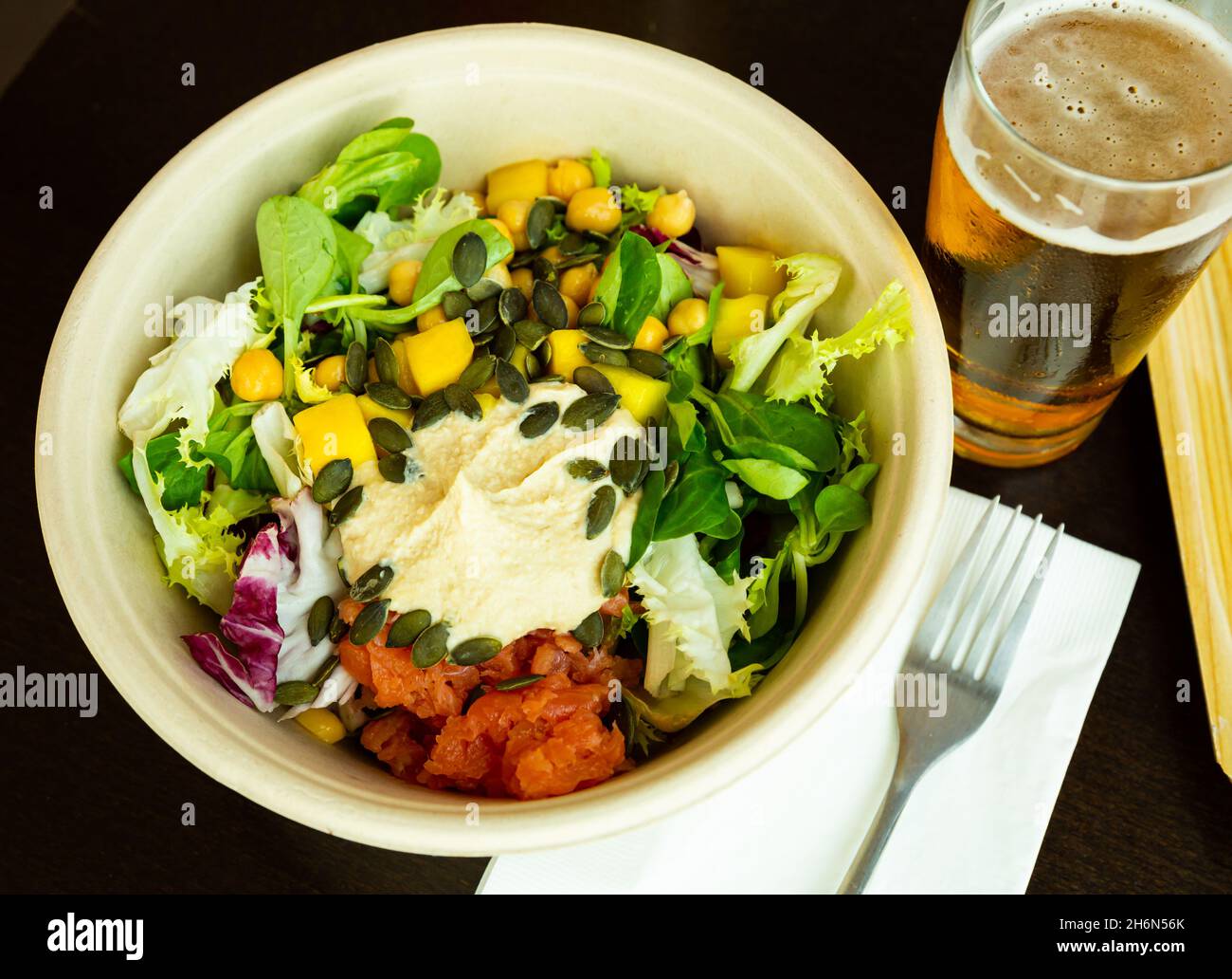 Fish salad with hummus and salmon Stock Photo - Alamy