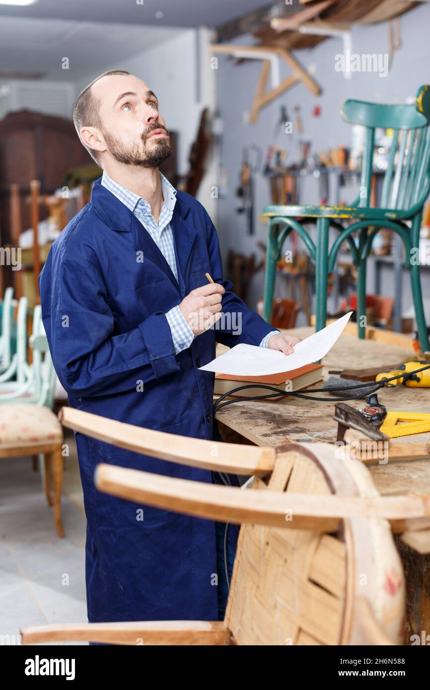 Carpenter repairing antique chair Stock Photo - Alamy