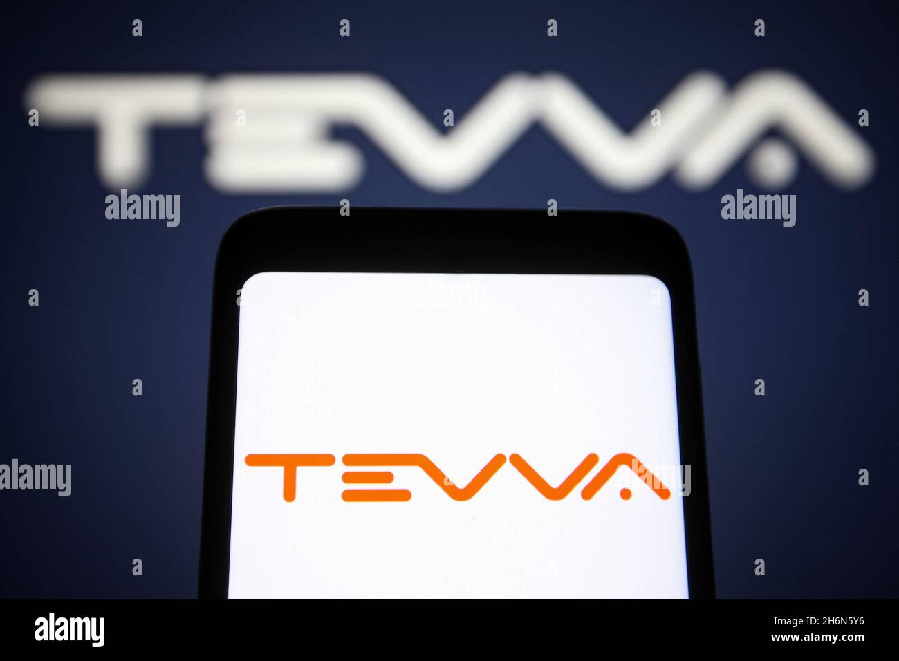 In this photo illustration, a Tevva logo is seen on a smartphone and a pc screen. (Photo by ...