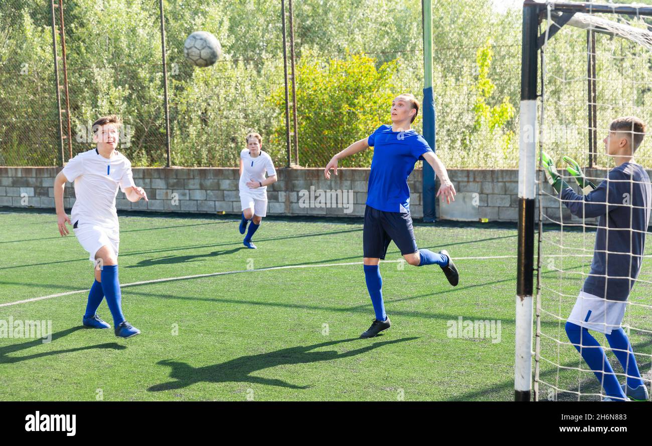 Young football players fighting for ball Stock Photo - Alamy
