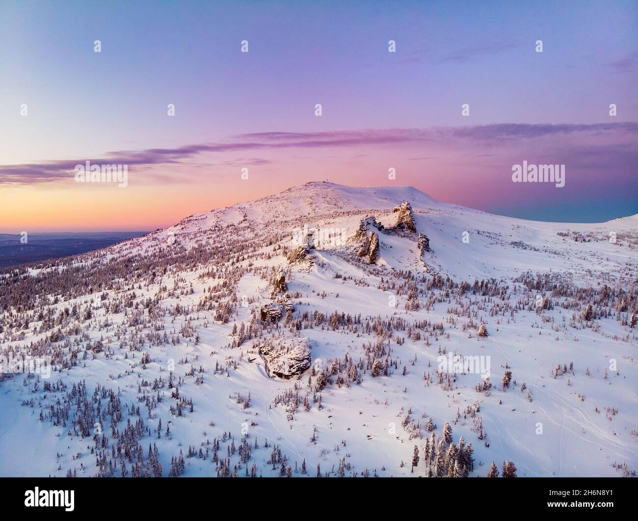 Colorful winter sunset in Sheregesh ski resort mountains with clouds ...