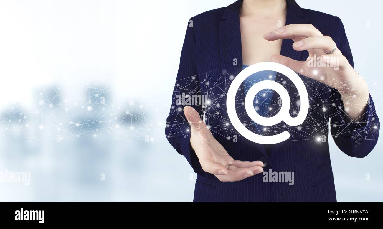 Email marketing concept. Sending newsletter. Two hand holding virtual ...