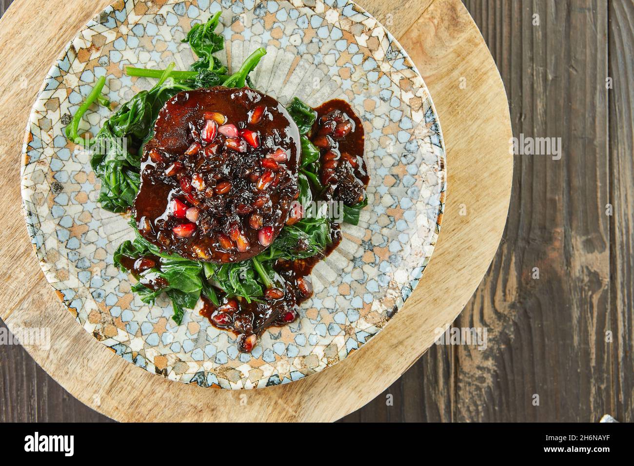 Cod with sorrel and pomegranate butter sauce. French gourmet cuisine ...