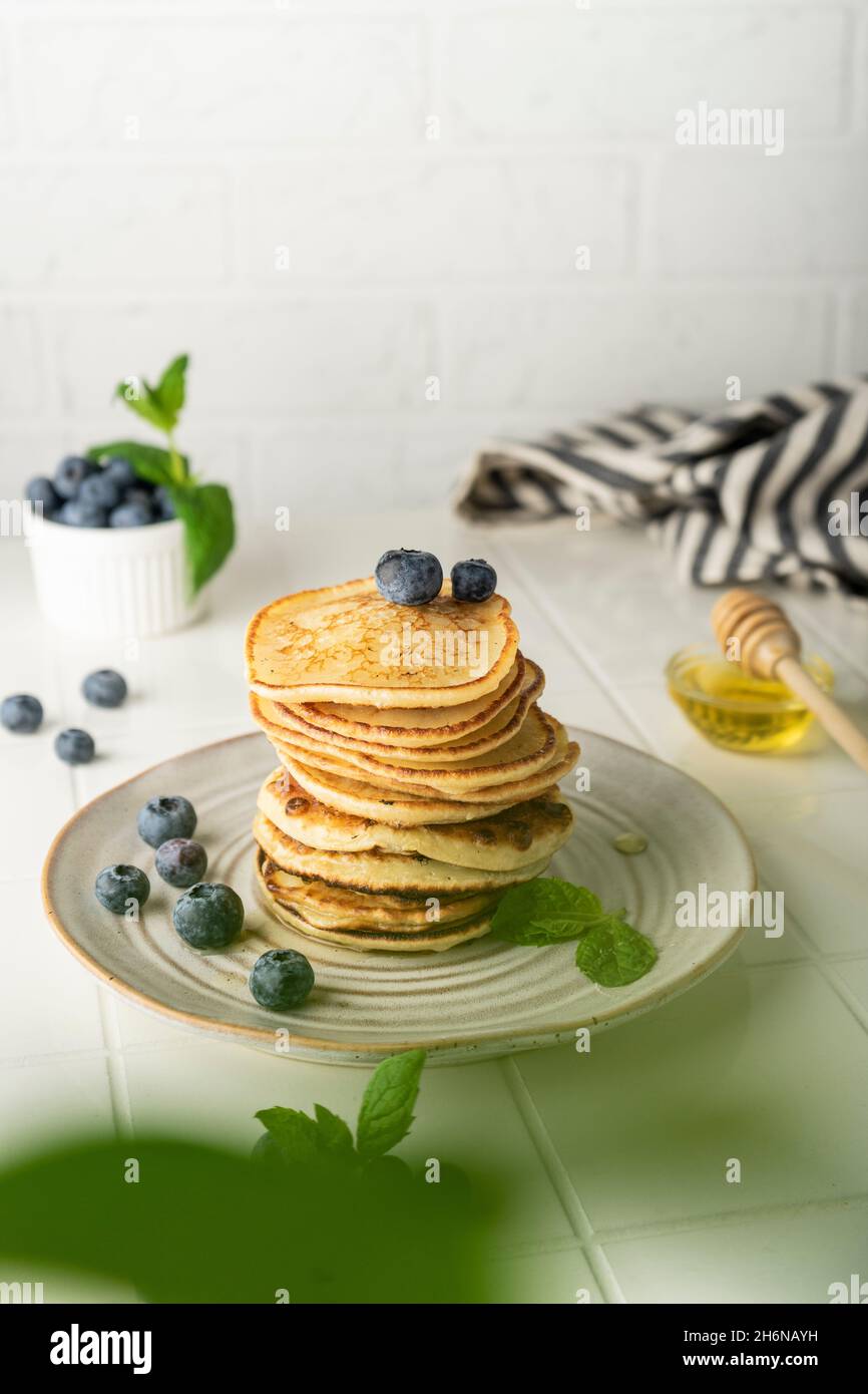 sweet pancakes for breakfast in a stack. on a ceramic plate. with fresh ...