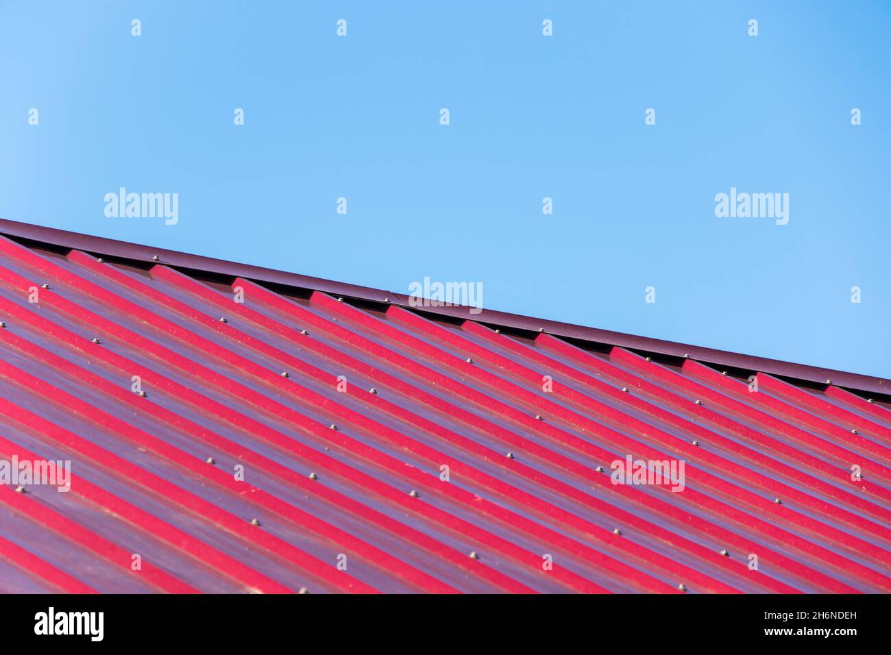 Red roof, house roof and sky background, sunlight Stock Photo - Alamy