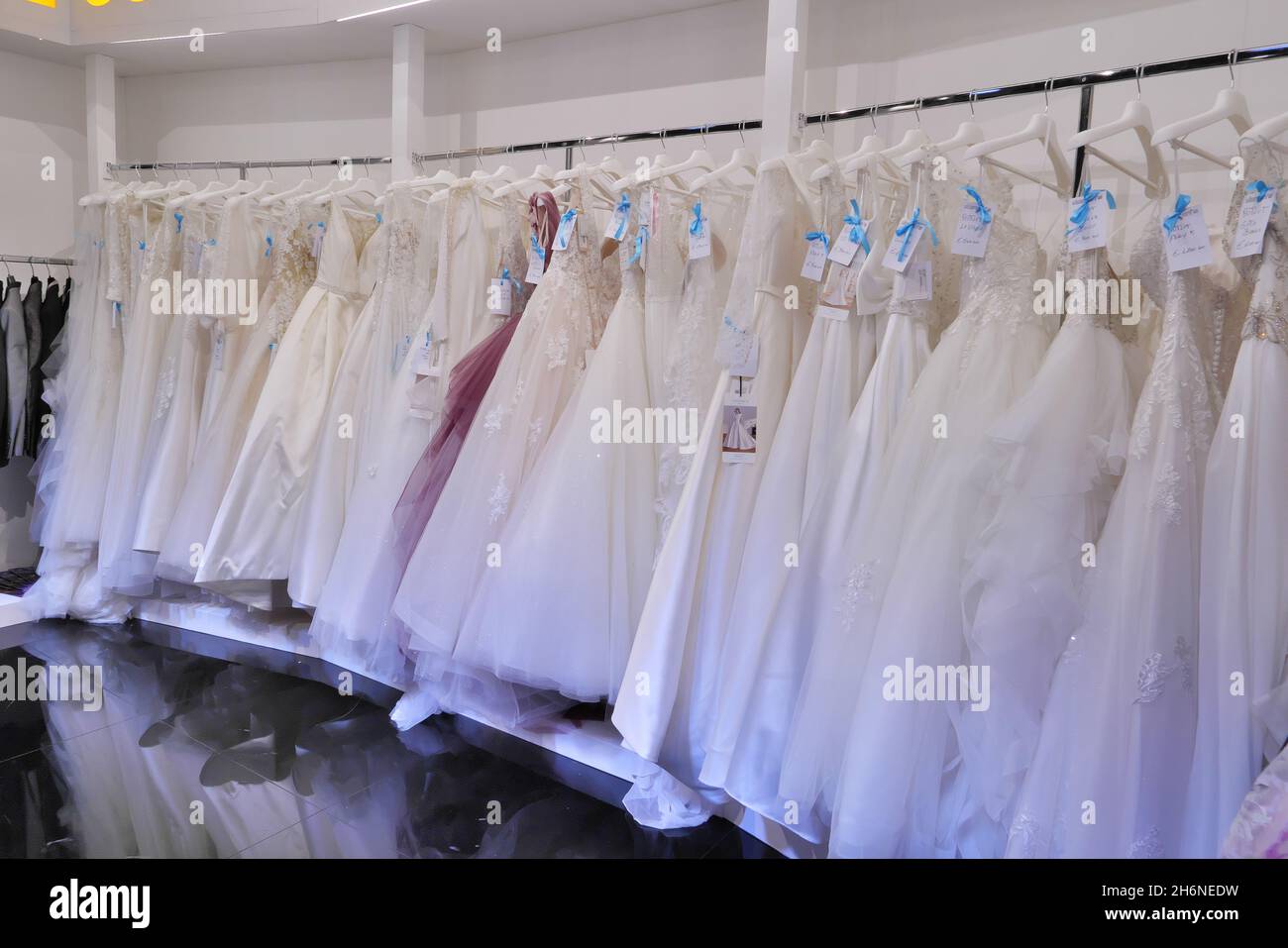 WEDDING DRESSES ON DISPLAY AT FASHION BOUTIQUE Stock Photo - Alamy