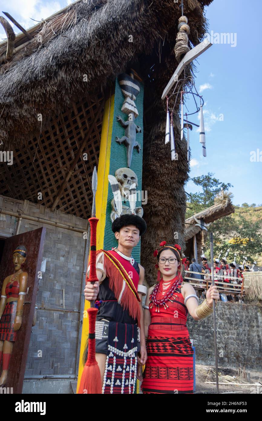 Naga tribesman and a Naga Tribeswomen dressed in traditional attire ...