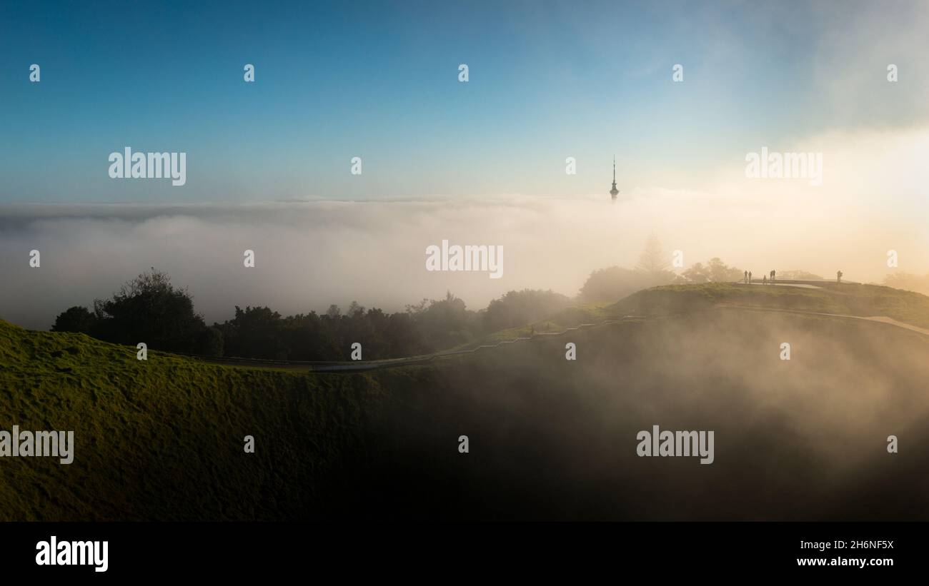 View from Mt Eden summit with fog drifting over volcanic crater and Sky ...