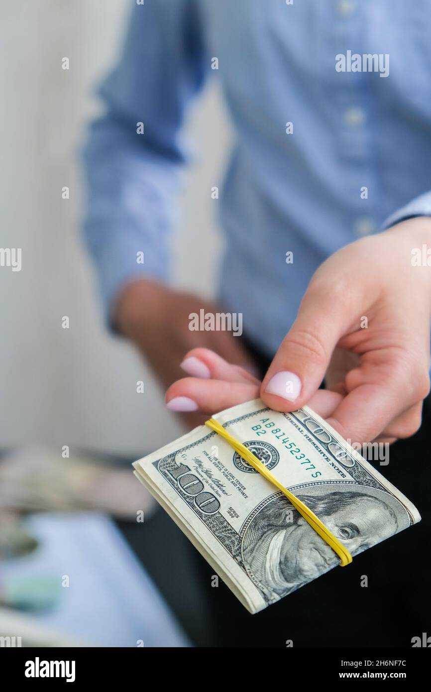 Business Woman Displaying a Spread of Cash US dollars. Close-up. Income ...
