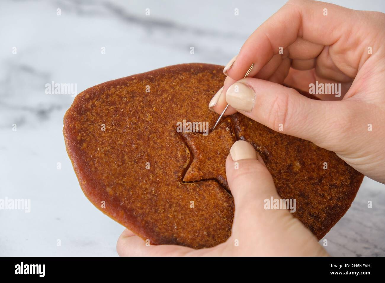 Kiev Ukraine - October 2021 Playing Korean Dalgona or Ppopgi honeycomb ...