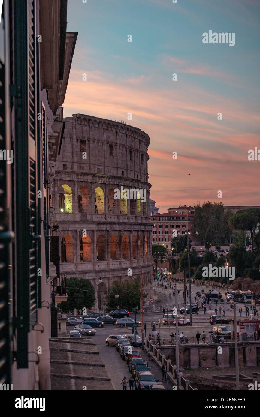 colosseum at sunset, unique top view from a window. Rome, Italy Stock ...