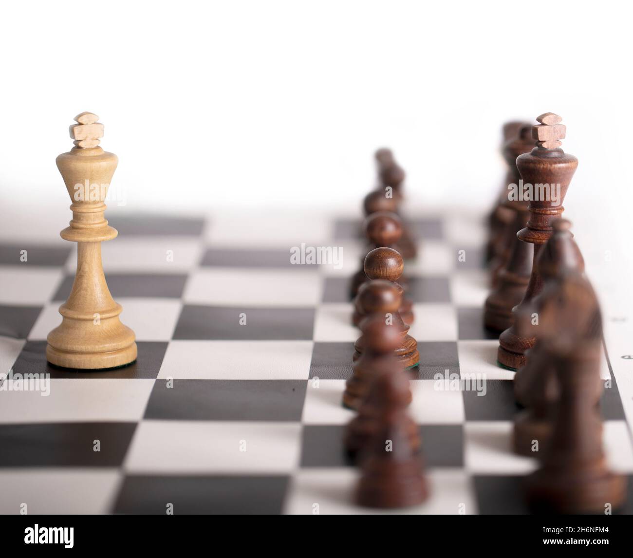 Chess pieces on a chessboard. The concept of playing and winning a ...