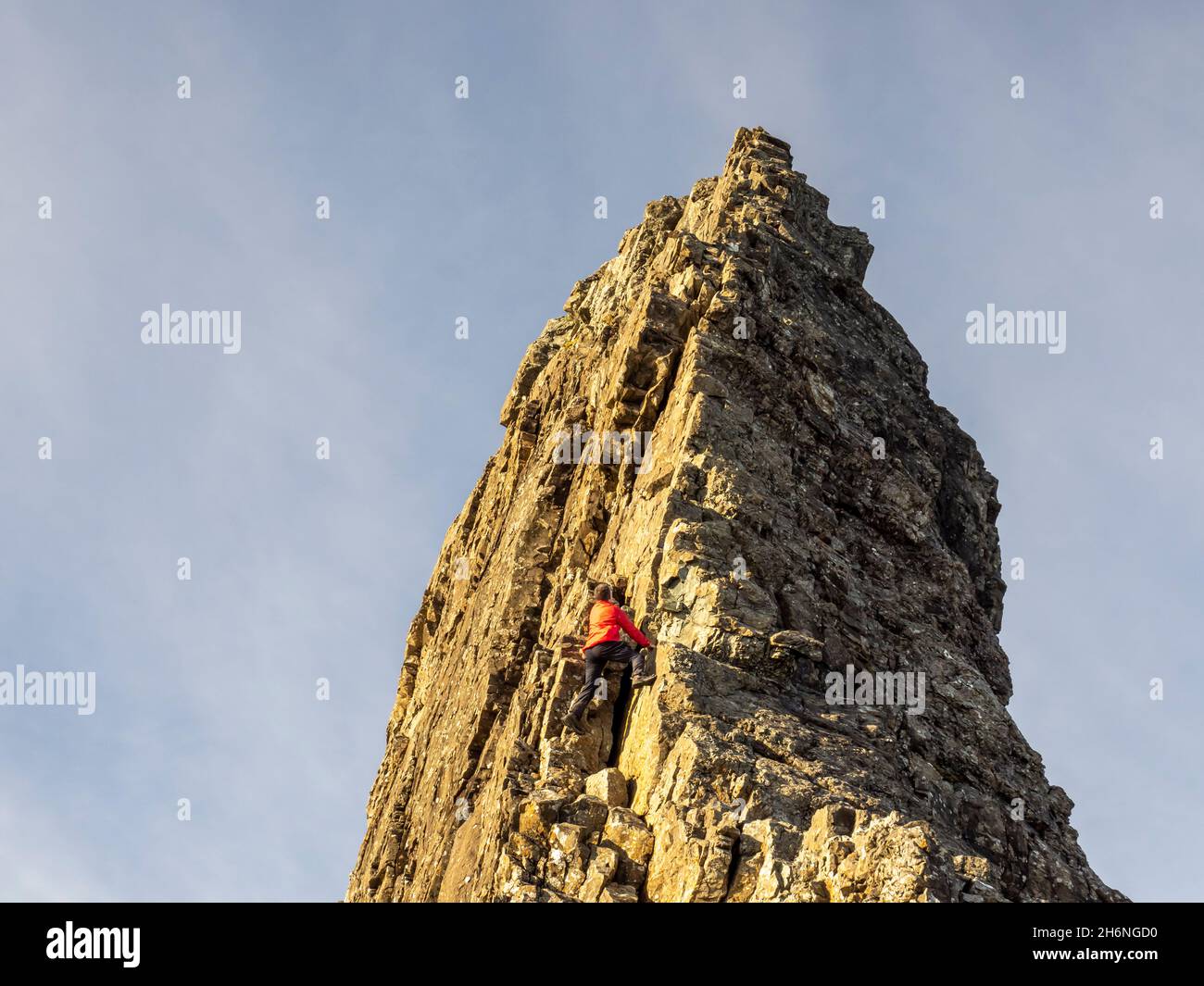 A climber soloing the Inaccessible Pinnacle on Sgurr Dearg on the ...