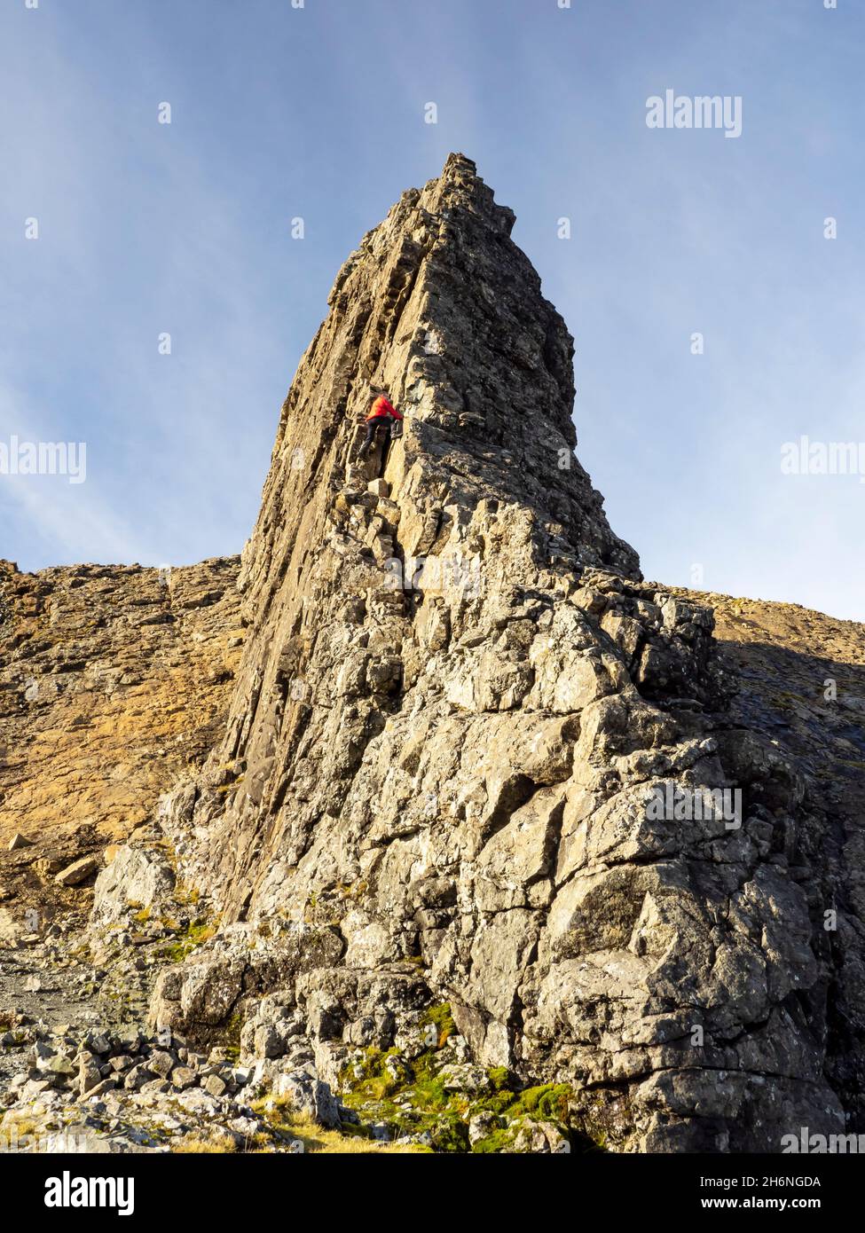 A climber soloing the Inaccessible Pinnacle on Sgurr Dearg on the ...