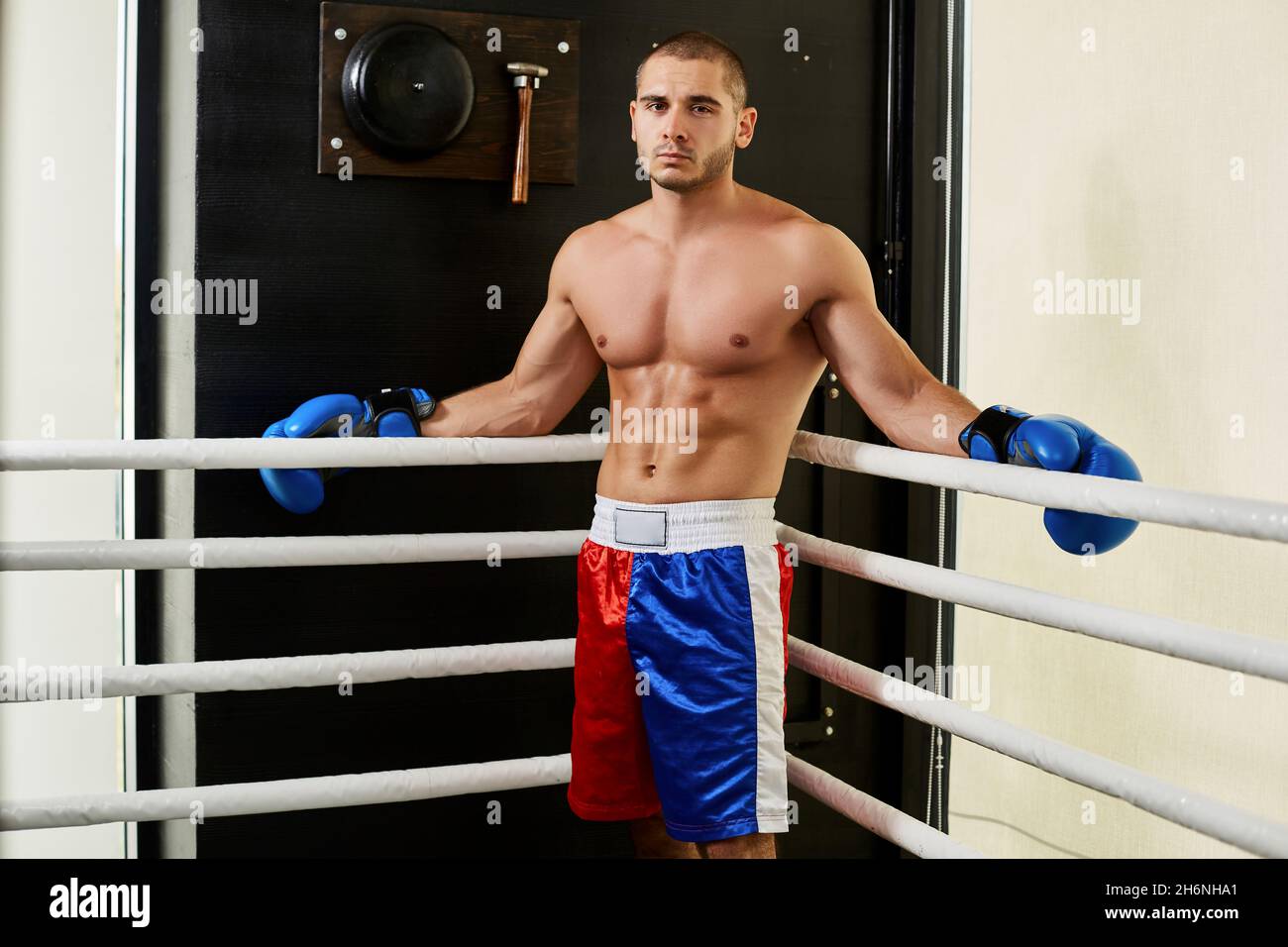 Boxer man standing in a corner of the ring Stock Photo - Alamy