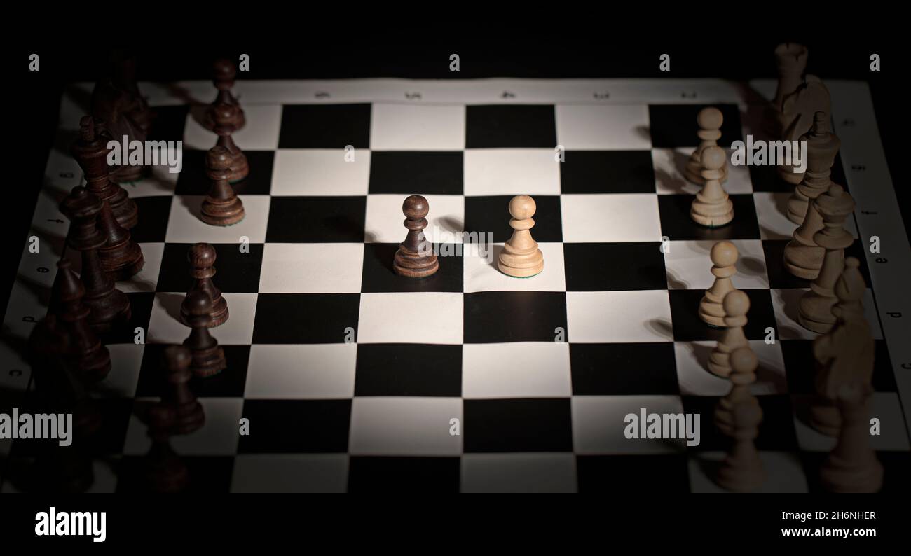 Chess pieces on a chessboard. The concept of playing and winning a ...