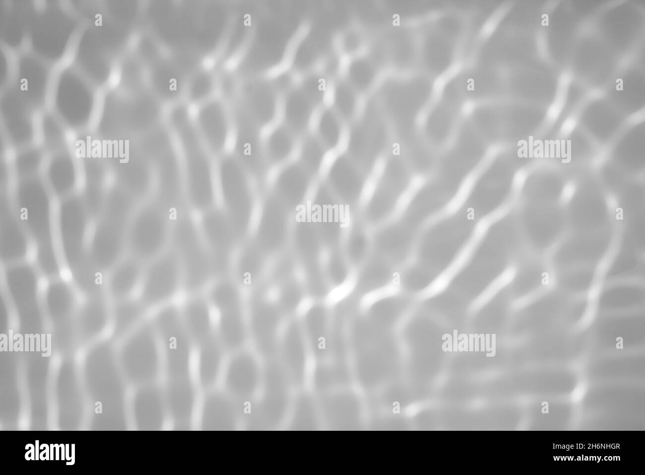 blurred shadow and light caustic effect on a white wall Stock Photo - Alamy