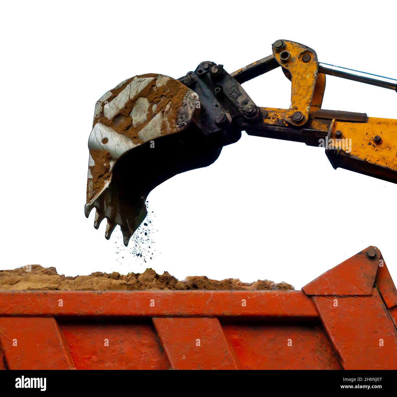 Orange excavator loading soil into a dumper truck isolated on white ...