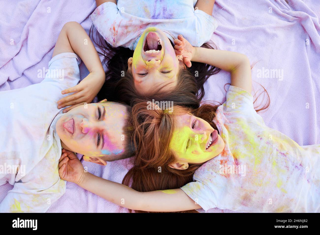 children with colored powder having fun outdoor Stock Photo - Alamy
