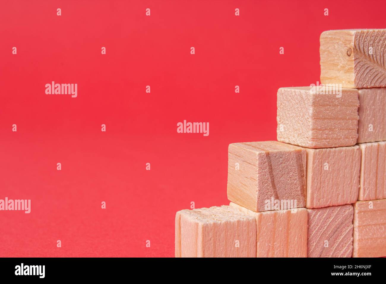 Closeup of the wooden blocks isolated on red background Stock Photo - Alamy
