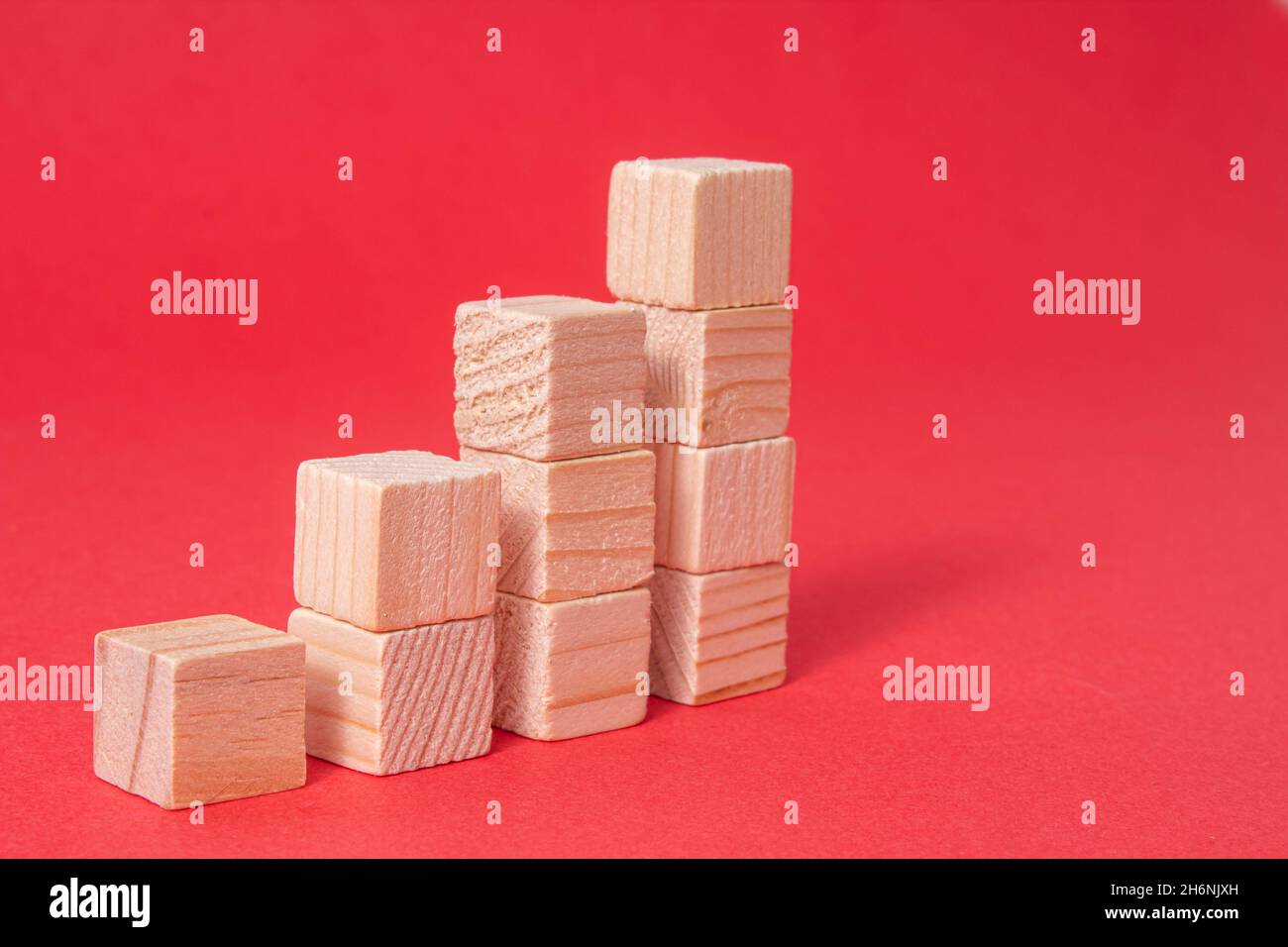 Closeup of the wooden blocks isolated on red background Stock Photo - Alamy