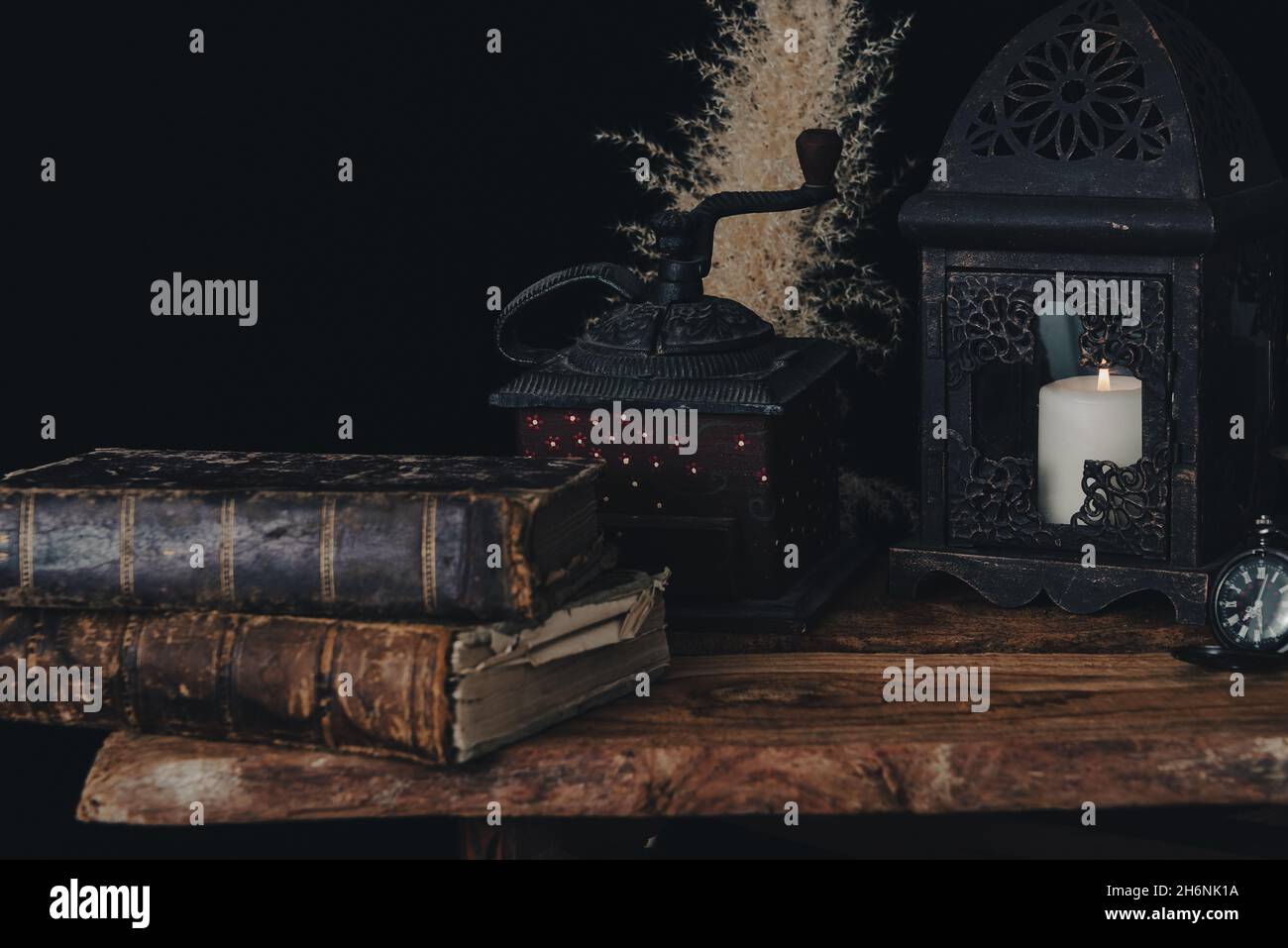Dark wallpaper romantic scene of books, candles and mystery Stock Photo ...