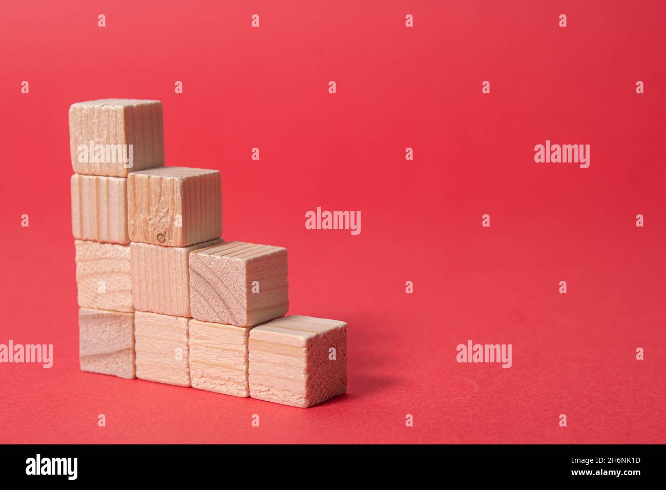 Closeup of the wooden blocks isolated on red background Stock Photo - Alamy