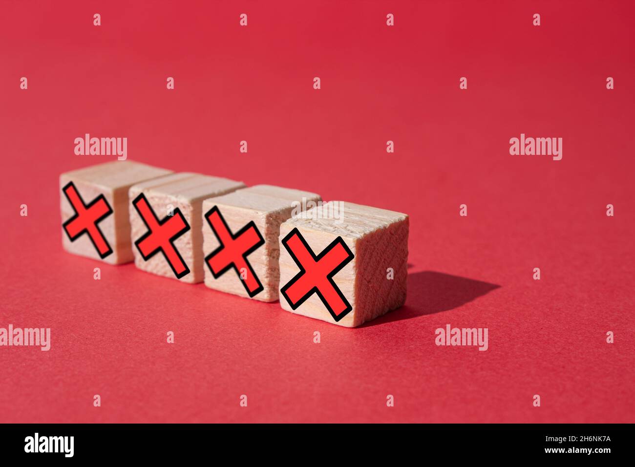 Closeup of the wooden blocks with cross marks Stock Photo - Alamy