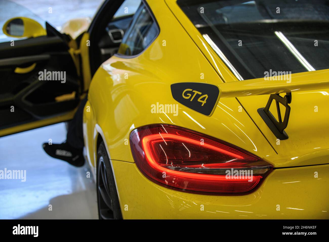 Detail of rear spoiler of Porsche Cayman GT4 with logo GT4 in pitbox ...