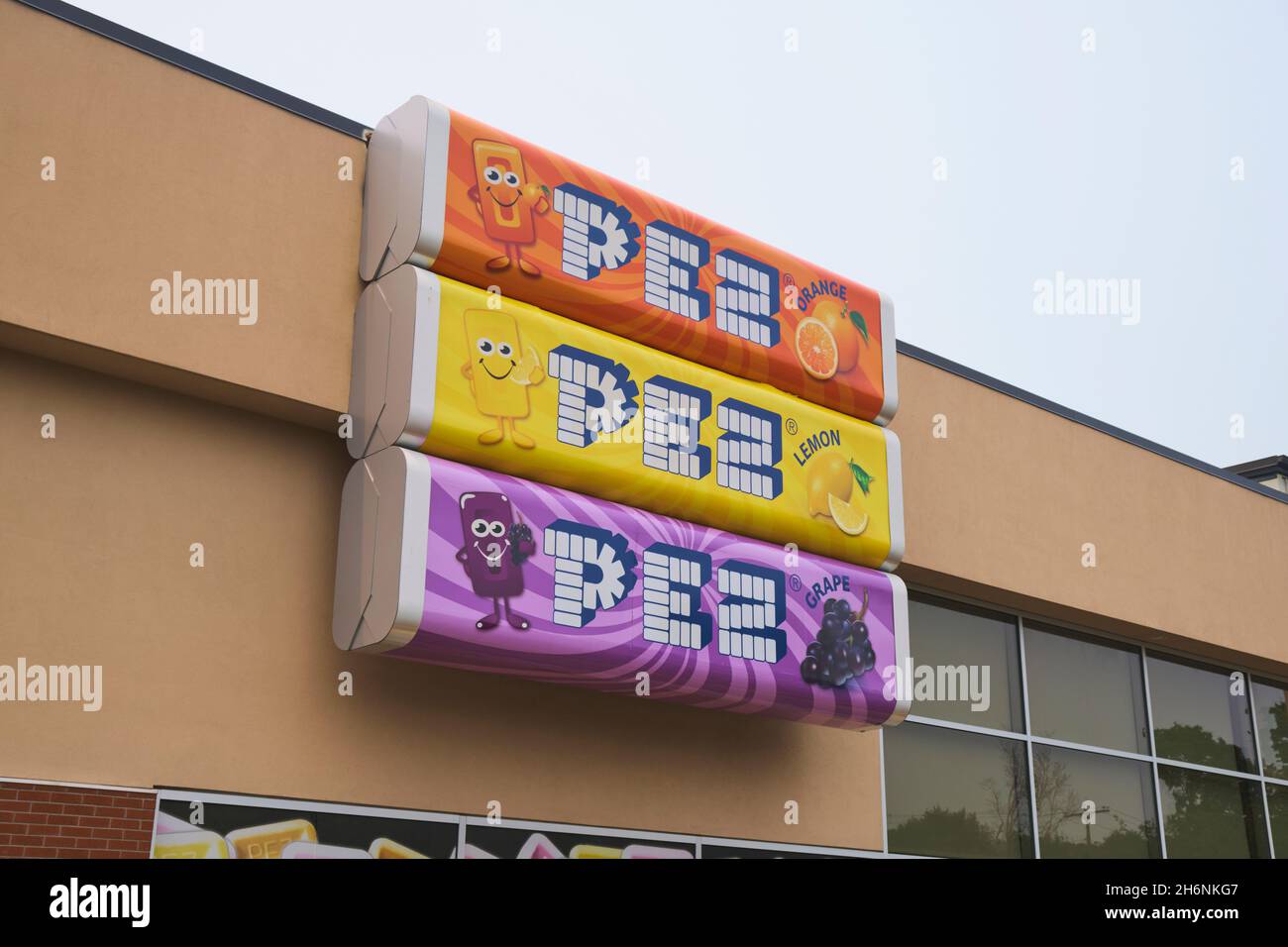 The big exterior sign at the entrance, a multi flavor pack of orange ...