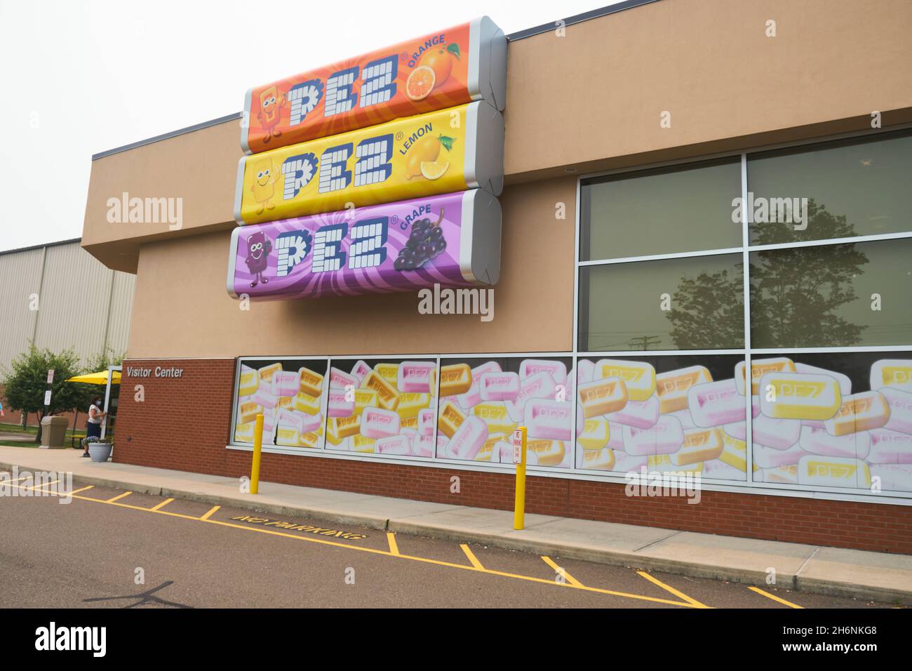 The big exterior sign at the entrance, a multi flavor pack of orange ...