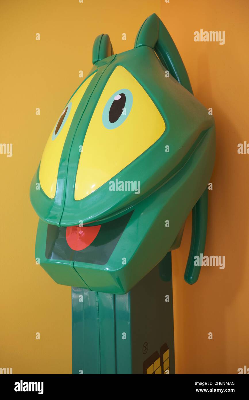 A big, green bug, monster Pez dispenser head. At the Pez factory ...