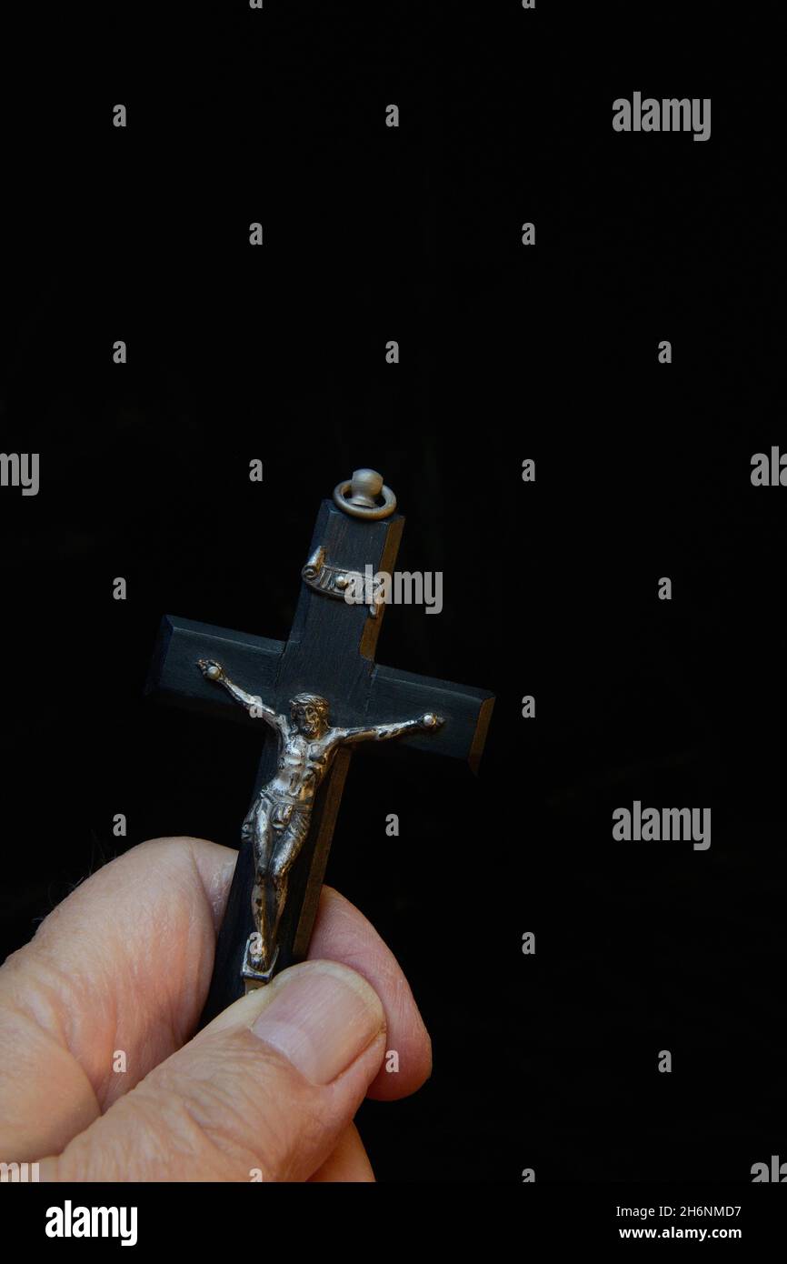 Hand holding crucifix, cross Stock Photo - Alamy