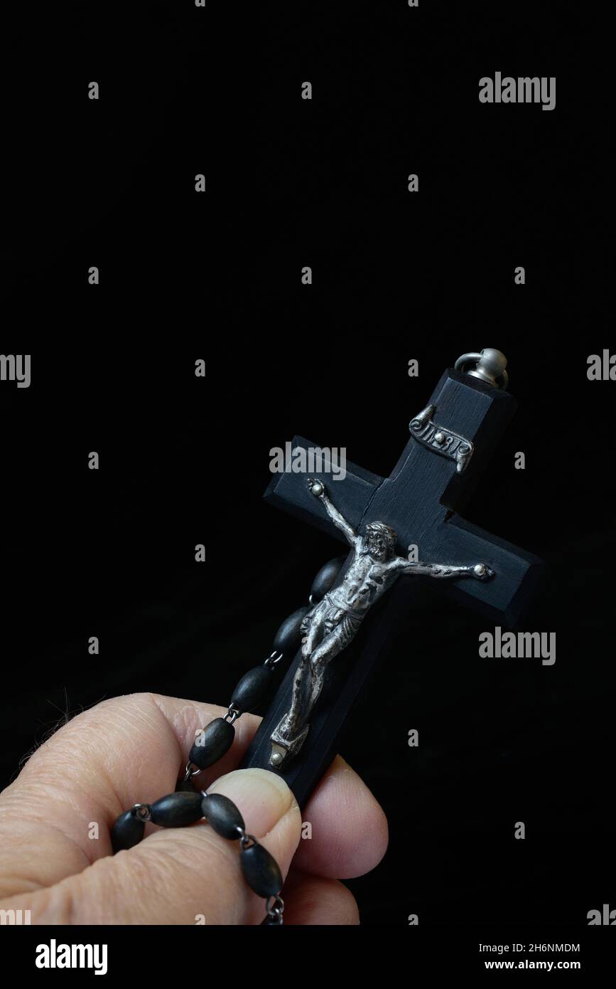 Hand holding crucifix, cross Stock Photo - Alamy