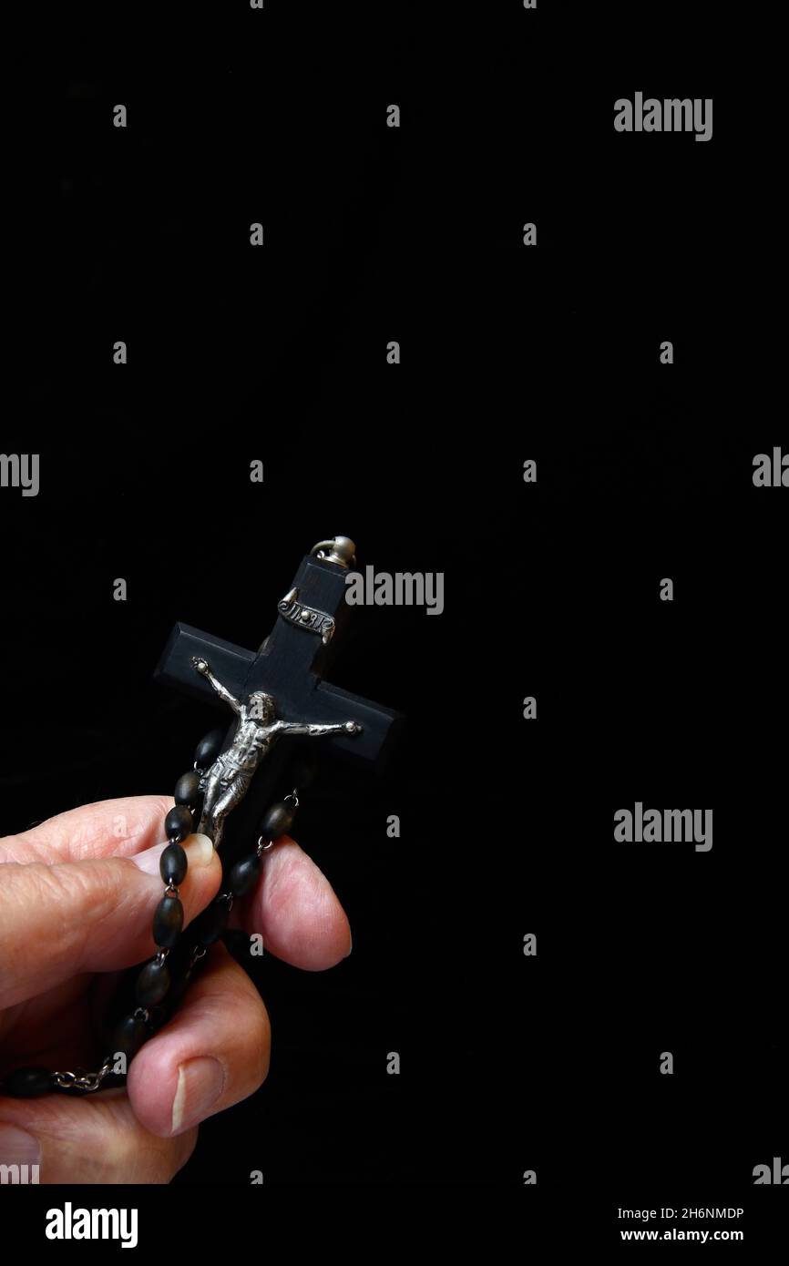Hand holding crucifix, cross Stock Photo - Alamy