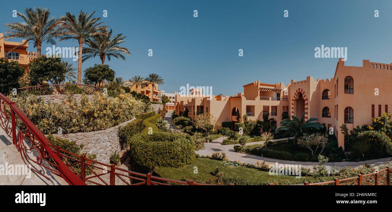 Luxury holiday villa with palm tree Stock Photo - Alamy