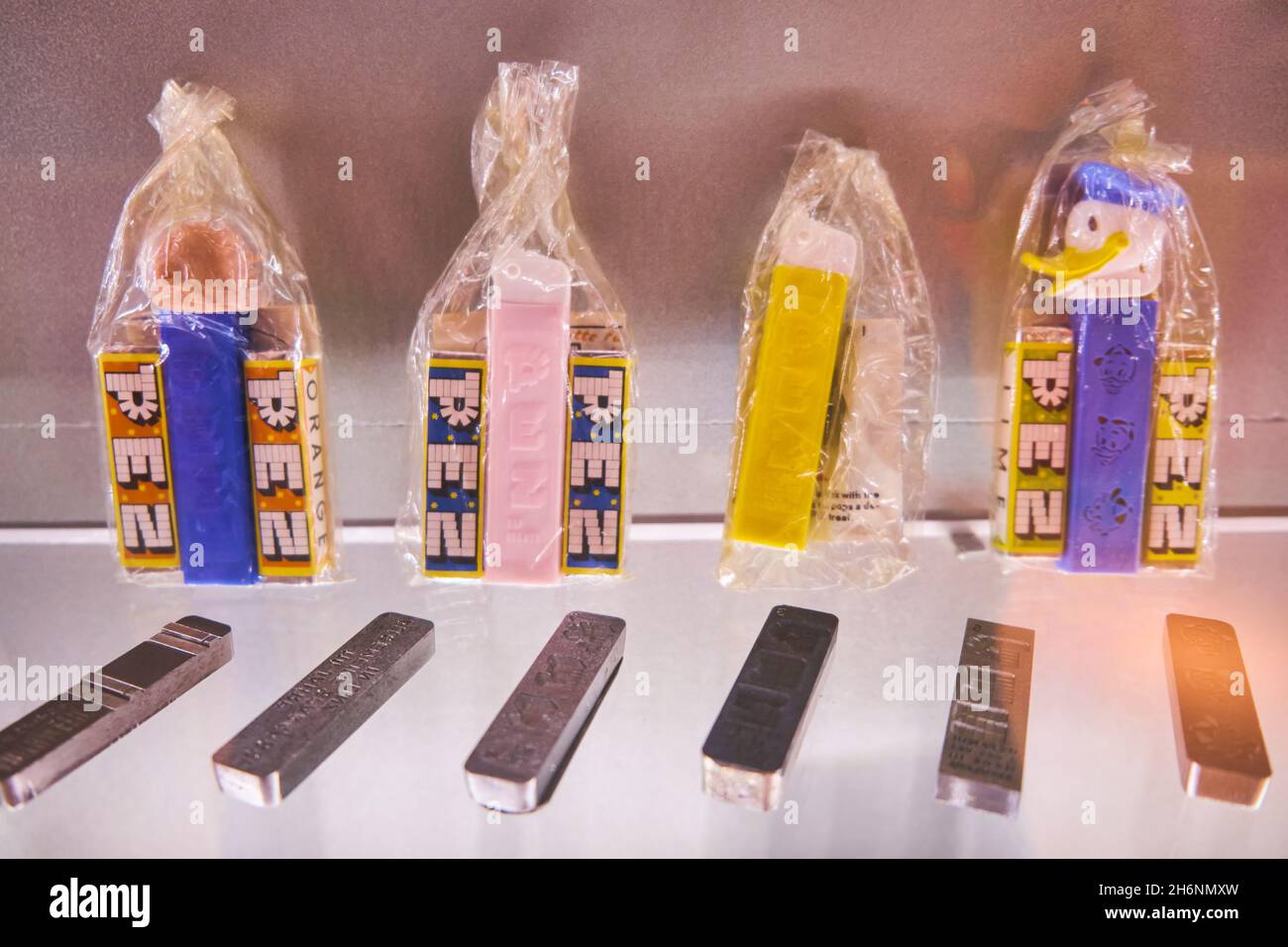 Pez dispensers behind the metal dies used to make them. At the Pez ...