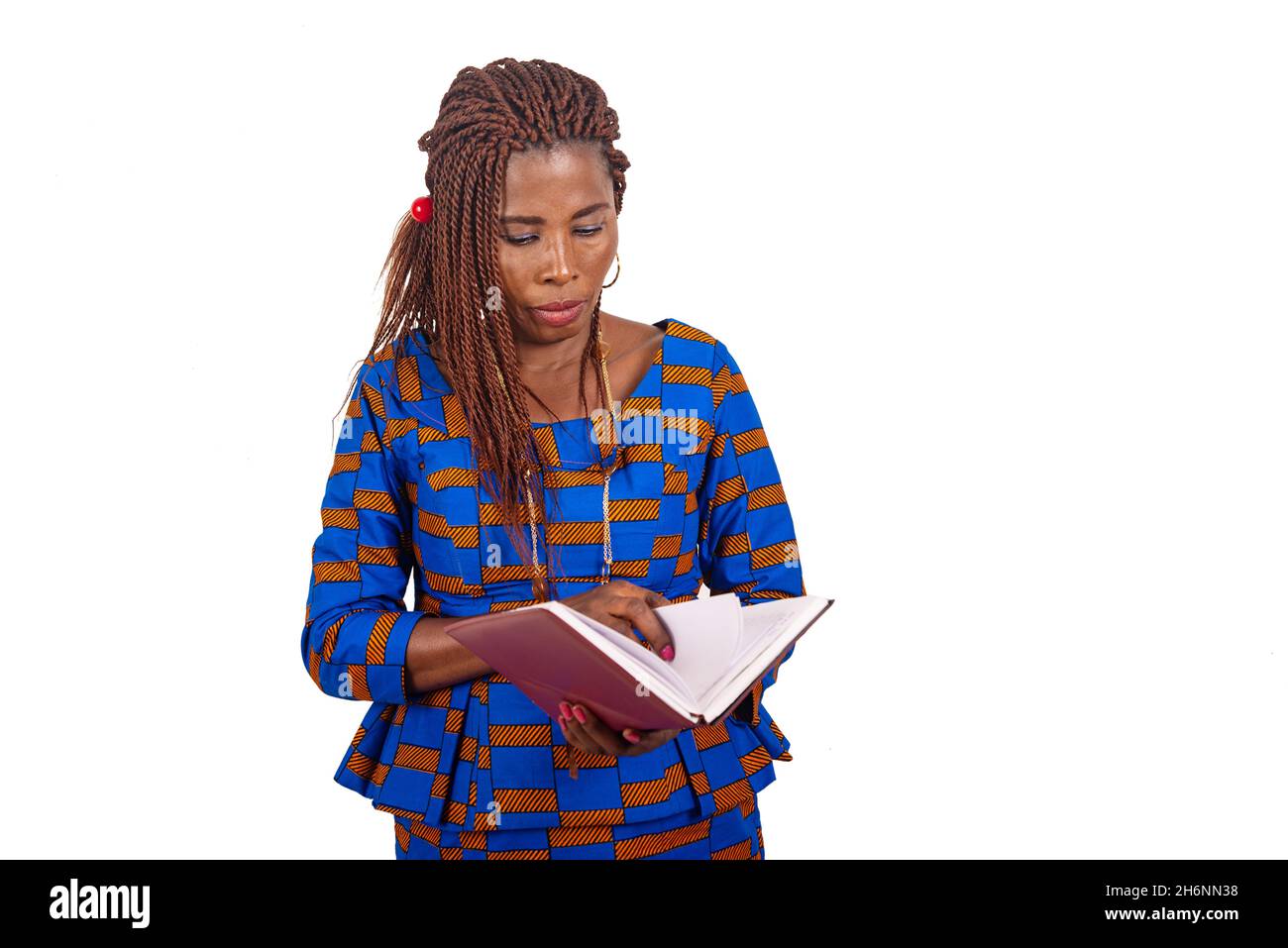beautiful businesswoman in traditional dress standing looking at her ...