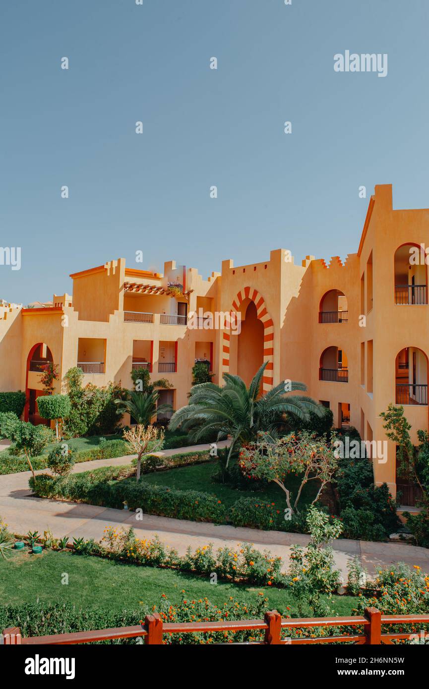 Luxury holiday villa with palm tree Stock Photo - Alamy