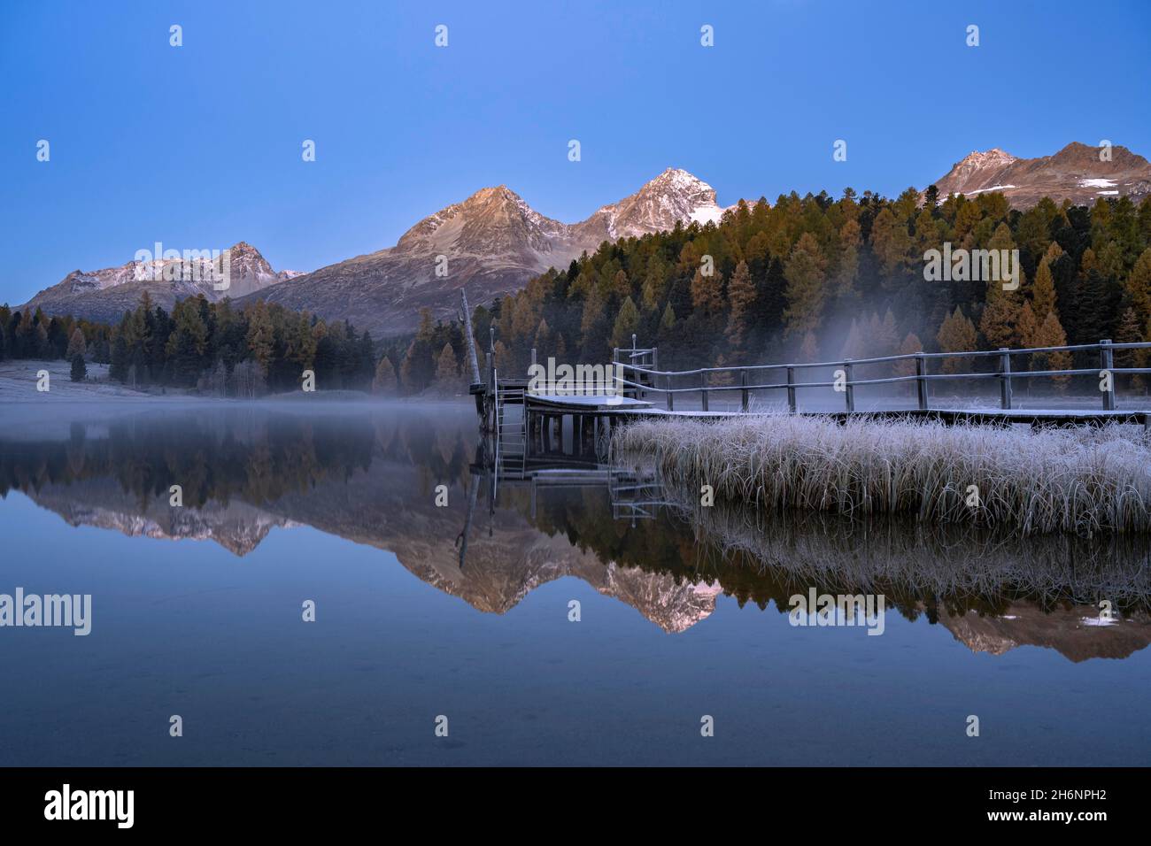 Mountain peaks reflected in Lake Staz, Lej da Staz, St. Moritz, Engadin ...