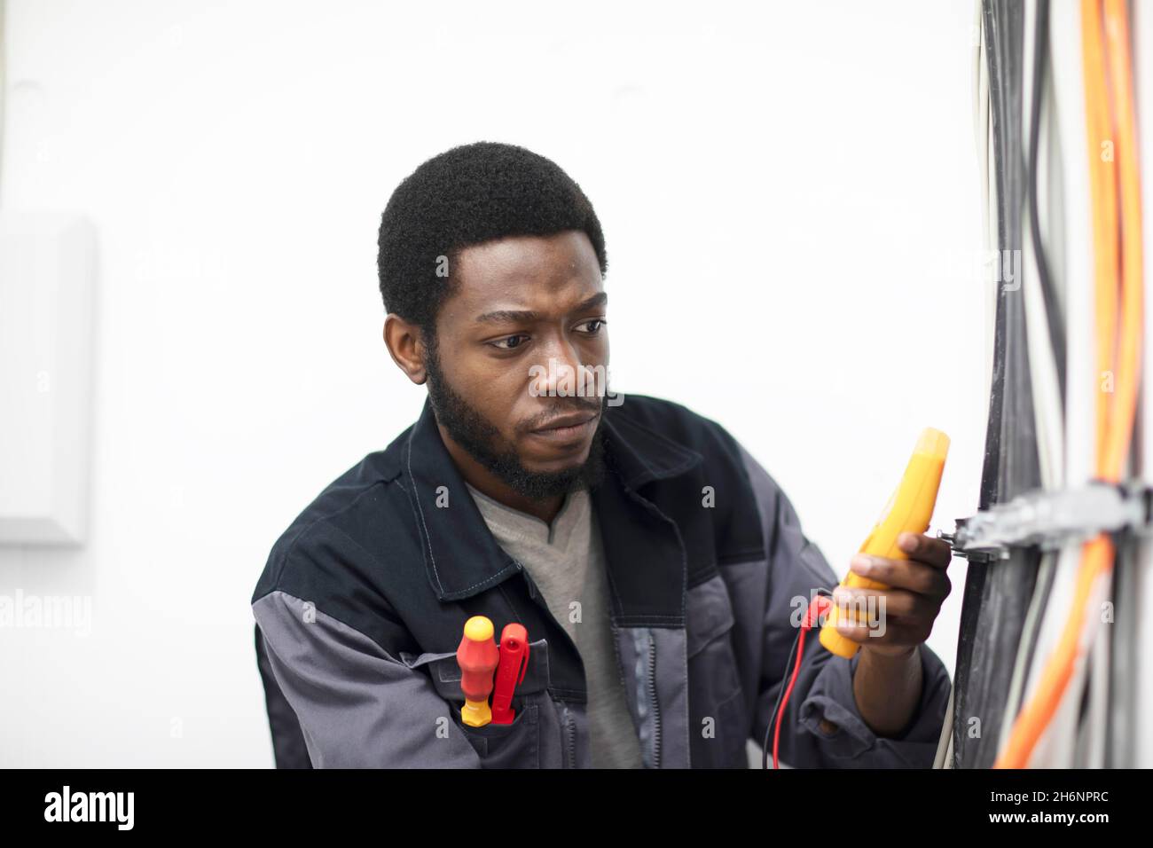 Young technician works in the building as a building technician in the ...