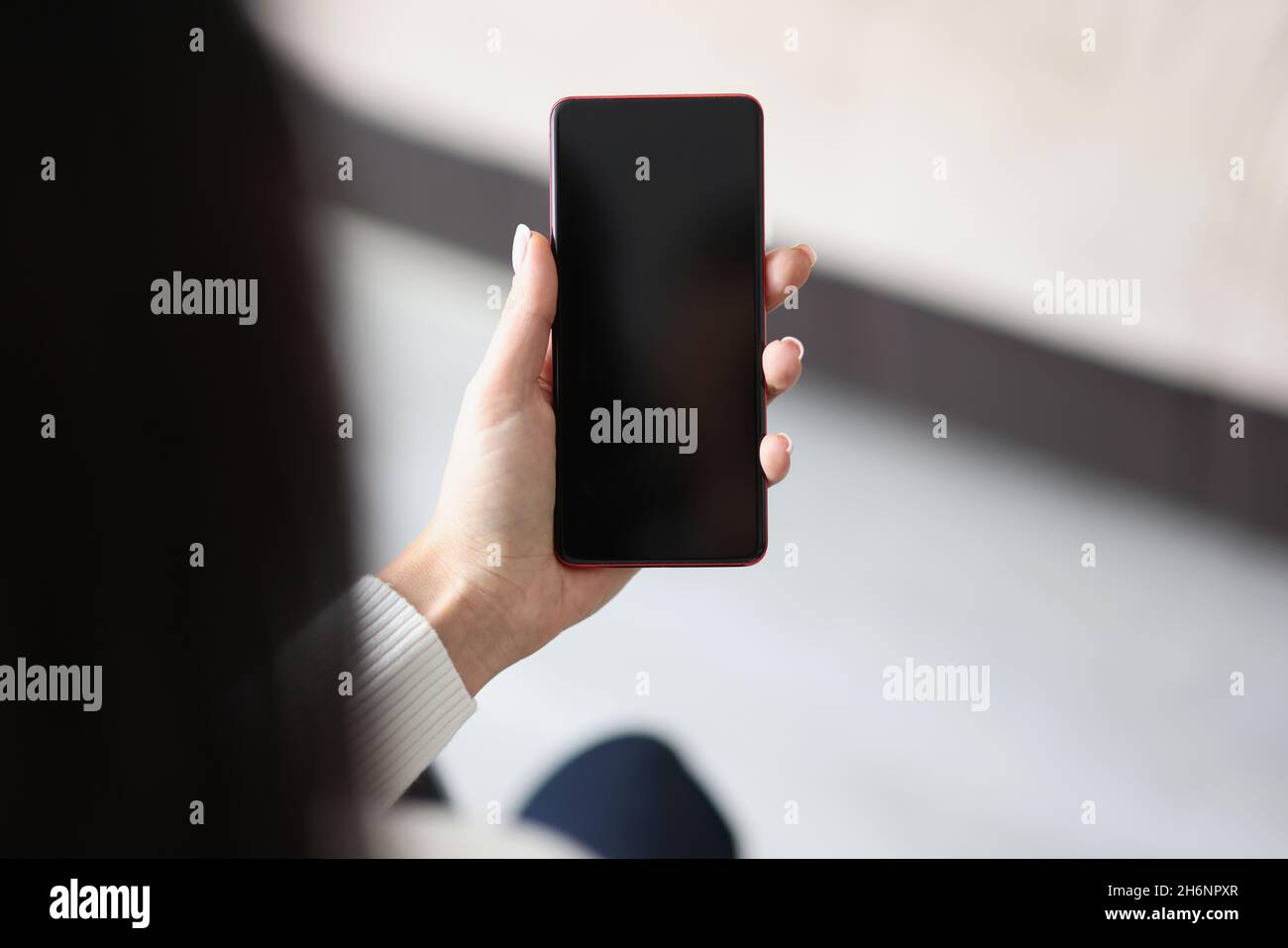 Woman hold smartphone with locked or turned off black screen Stock ...