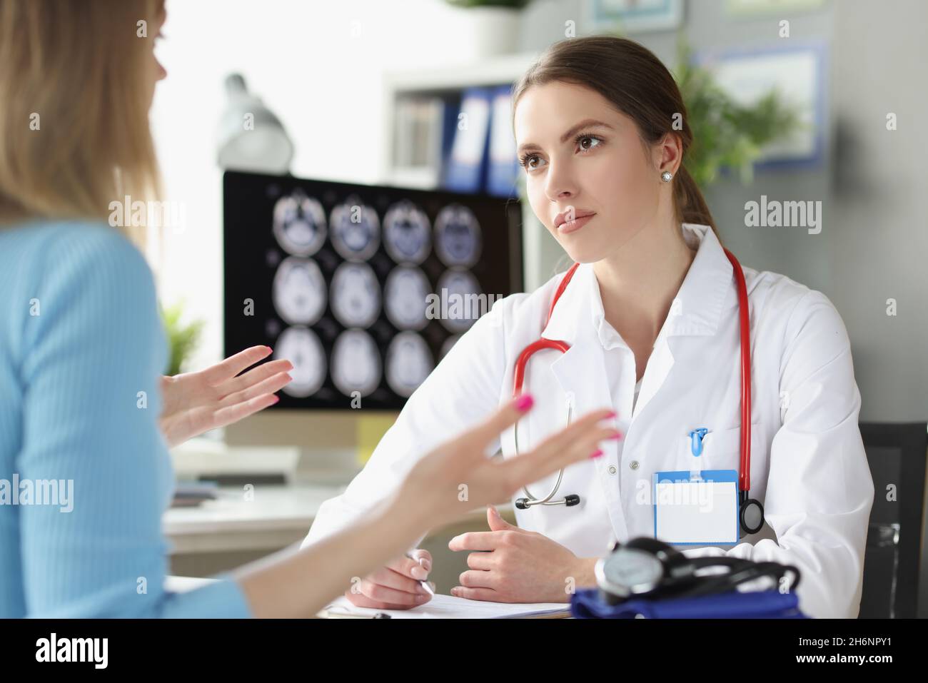 Female patient explain her problem to professional medical worker in ...
