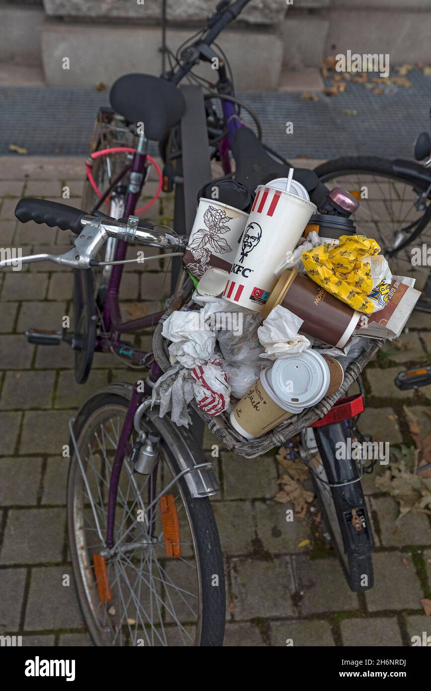 Parked bicycle, bicycle basket as rubbish bin, Bavaria, Germany Stock ...
