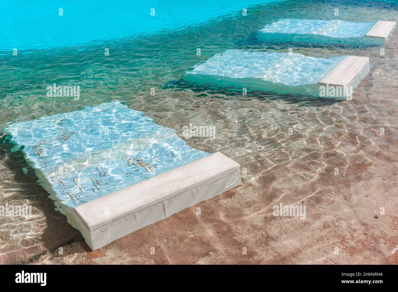 Swimming pool with underwater beds for resting. underwater pool bed ...